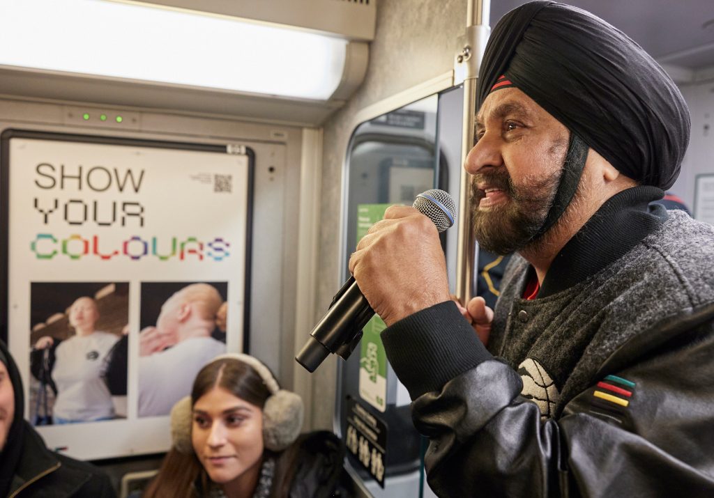GO Train riders get surprise party with Raptors Superfan Nav Bhatia in ...