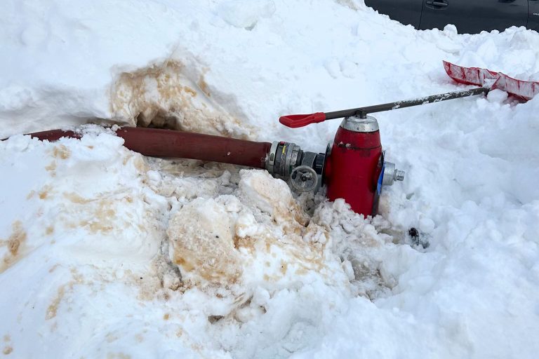 Fire hydrant buried in snow as building burns in Brampton | INsauga