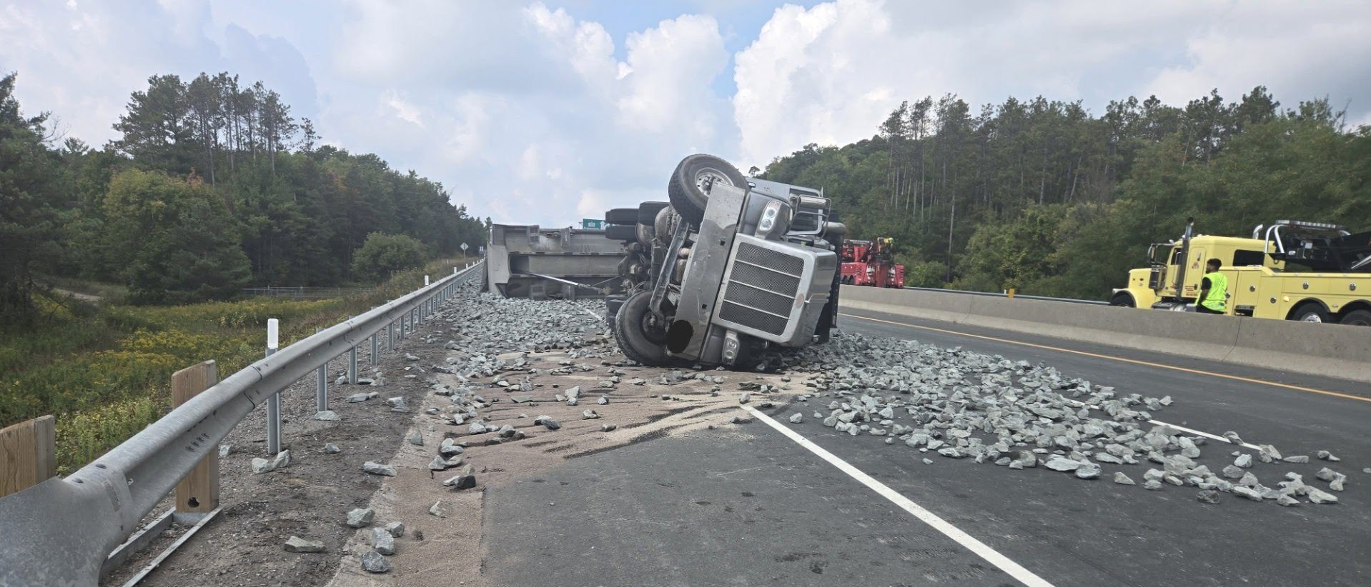 Busy Ontario road shut down, three in hospital as gravel truck rolls ...
