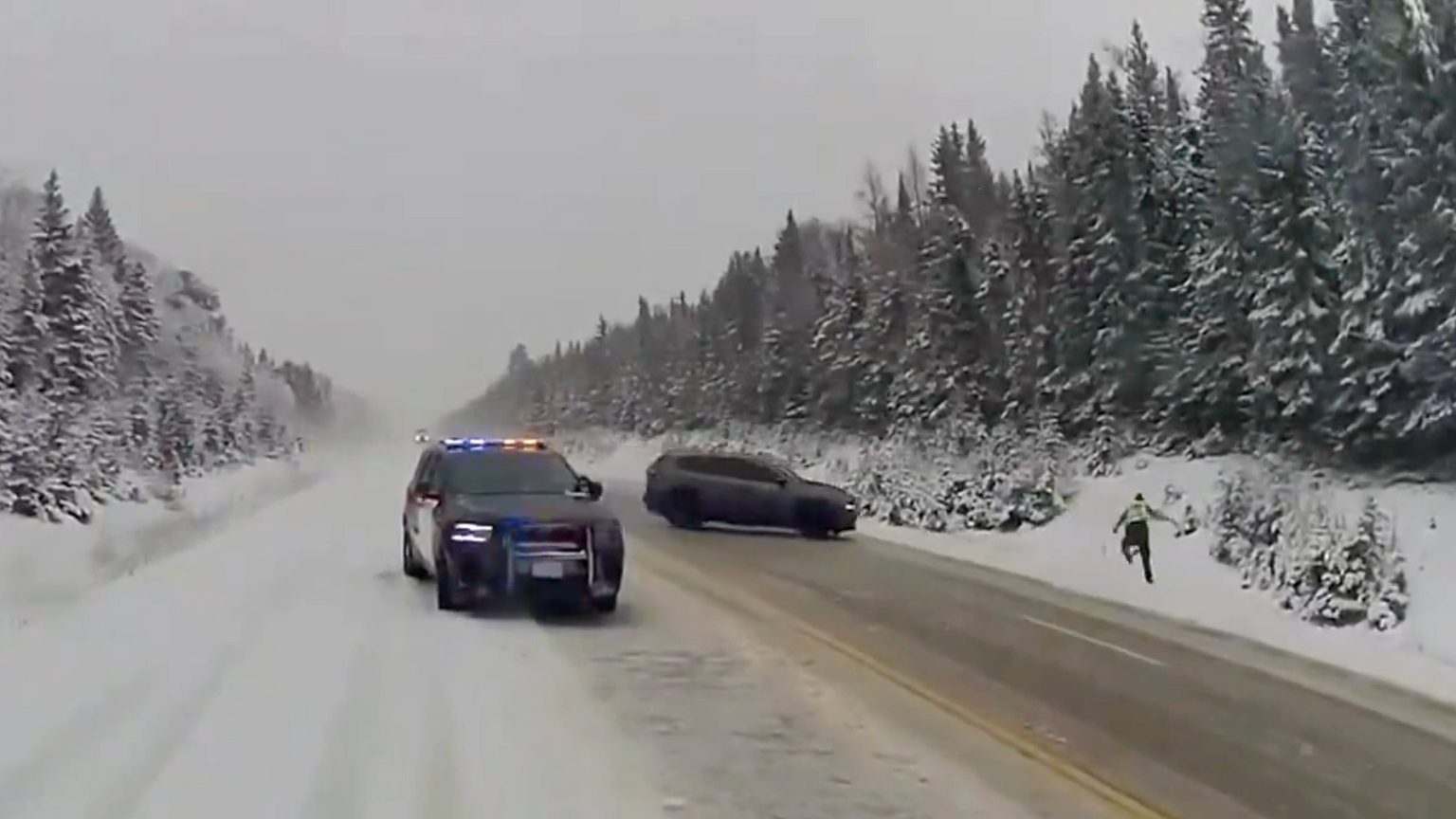 VIDEO: Police officer nearly hit as vehicle slides off Ontario highway ...