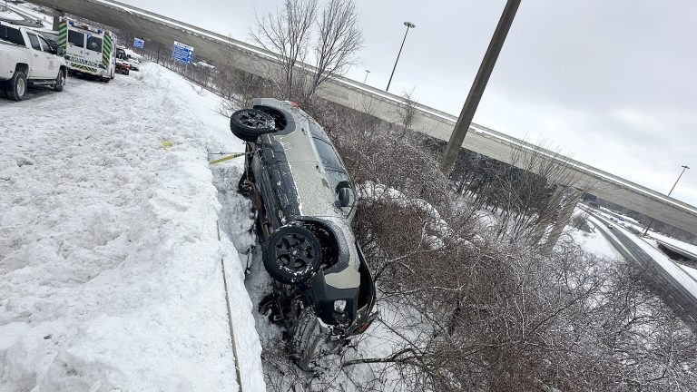 Bystanders rescue woman after vehicle rolled over guard rail on an ...